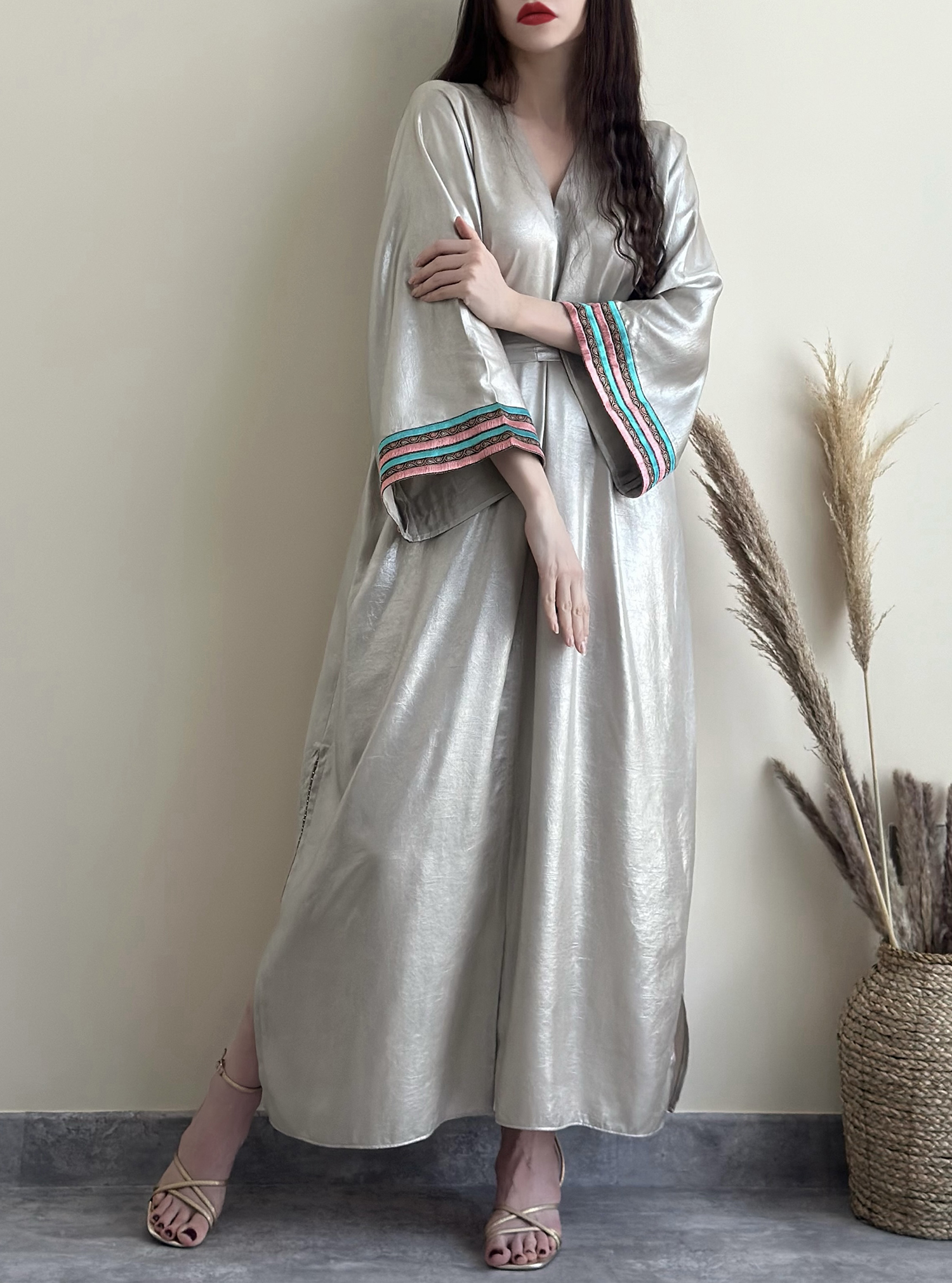 Shimmer kaftan Gold shimmer kaftan with V-neck and slits, decorated by ...