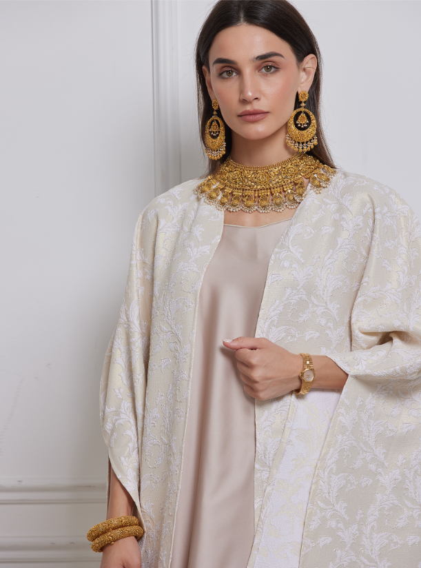 Gold Cape Kafan Pattern Luxury is a luxurious ensemble that combines ...